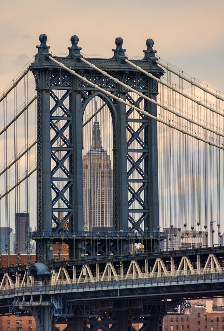 Empire State Building view through Manhattan Bridge, USA